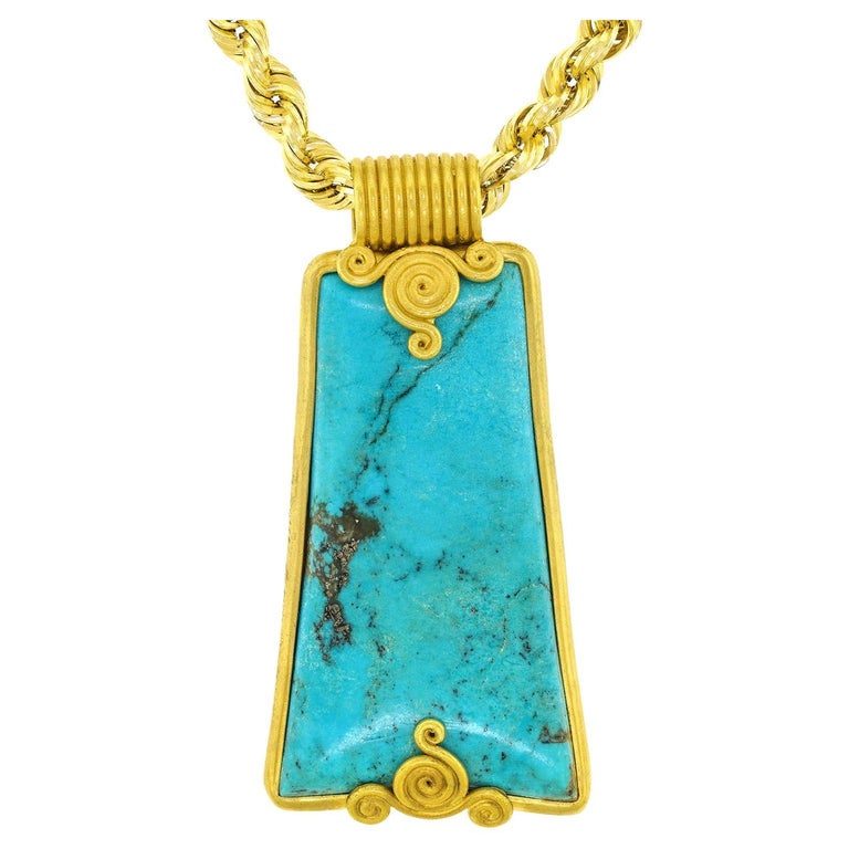 Seventies Archaic Motif Turquoise-Set Gold Pendant For Sale at 1stDibs
