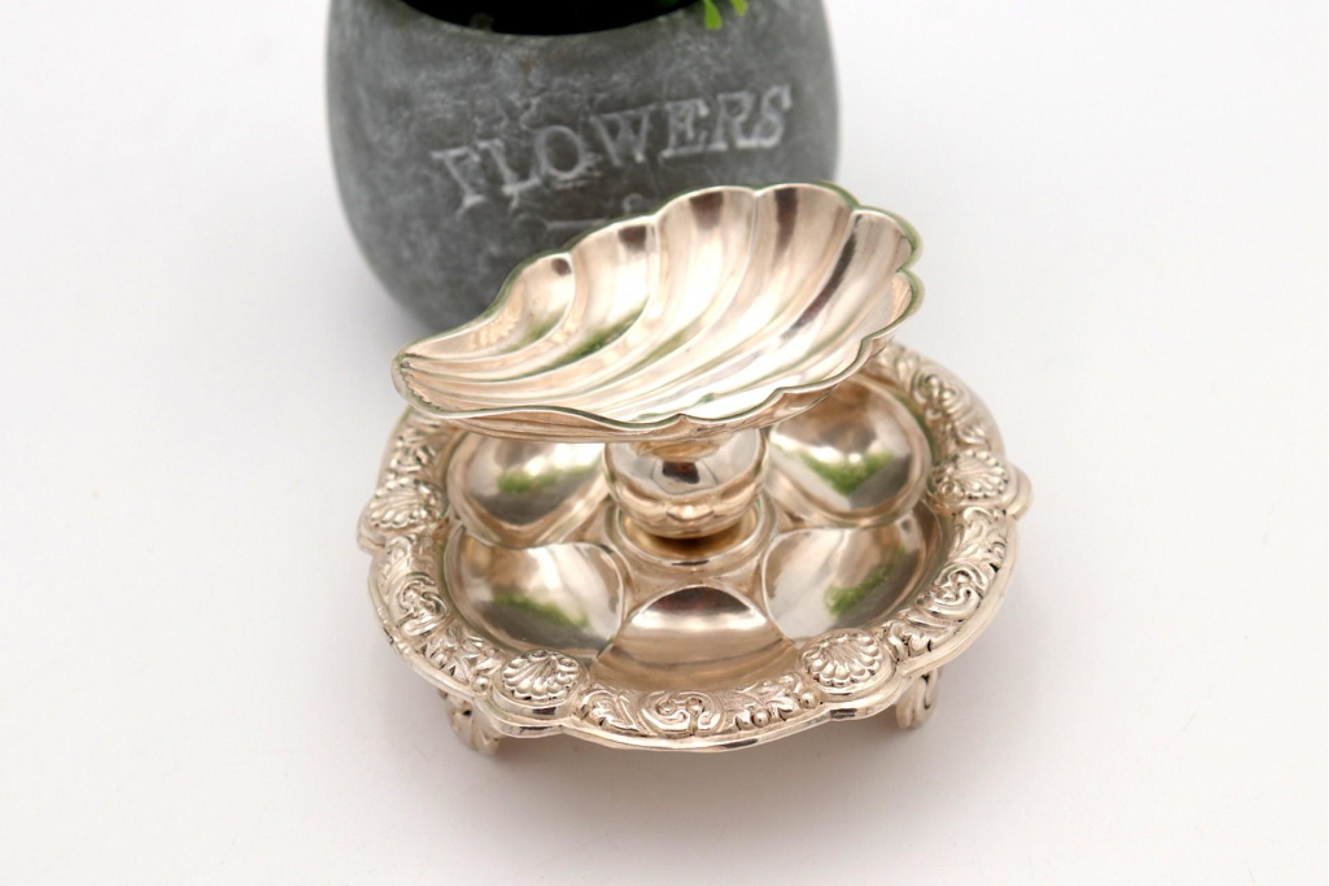 Shell-shaped ring on a ball and raised base with three cut-out feet For ...