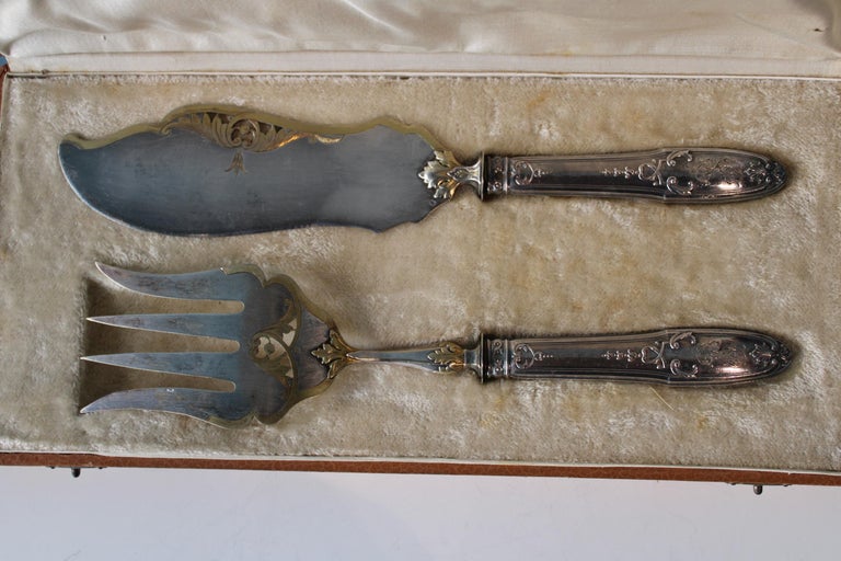 Silver and gold metal serving cutlery in their box For Sale at 1stDibs