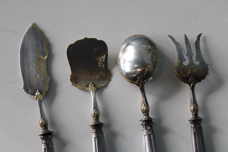 Silver and gold metal serving cutlery in their box For Sale at 1stDibs