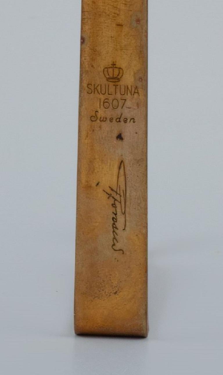 Skultuna, Sweden, a pair of brass candlesticks for wall hanging. For ...