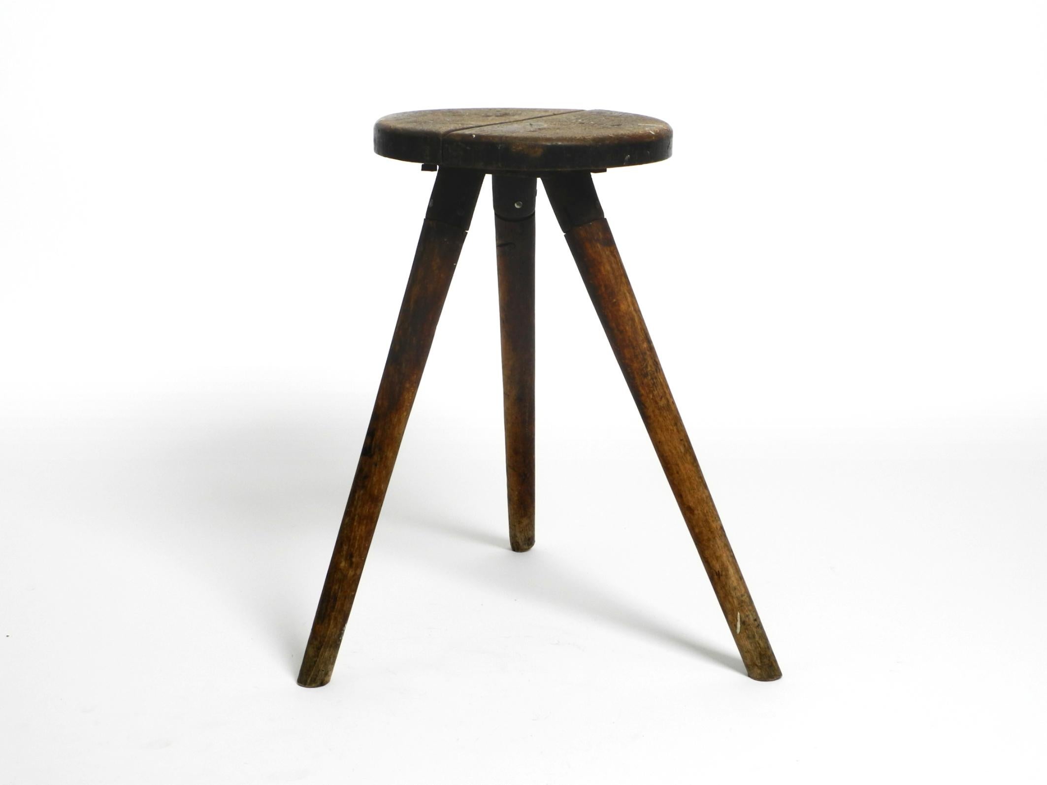Solid 1930s three-legged industrial stool made of oak For Sale at 1stDibs