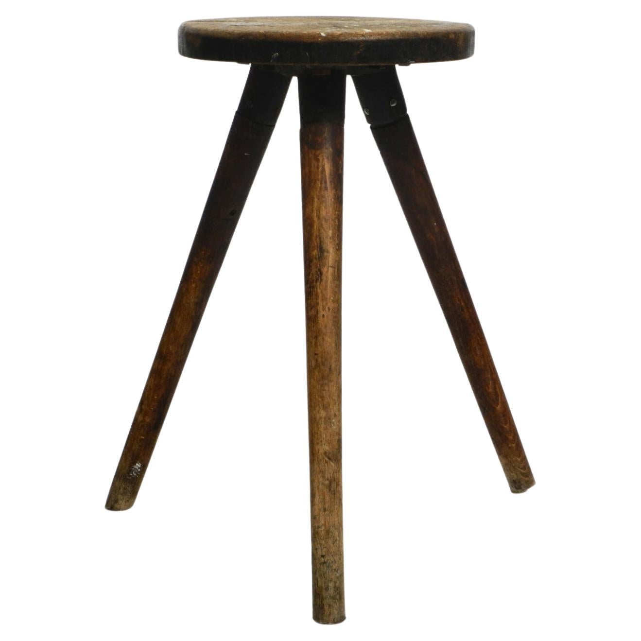 Solid 1930s three-legged industrial stool made of oak For Sale at 1stDibs