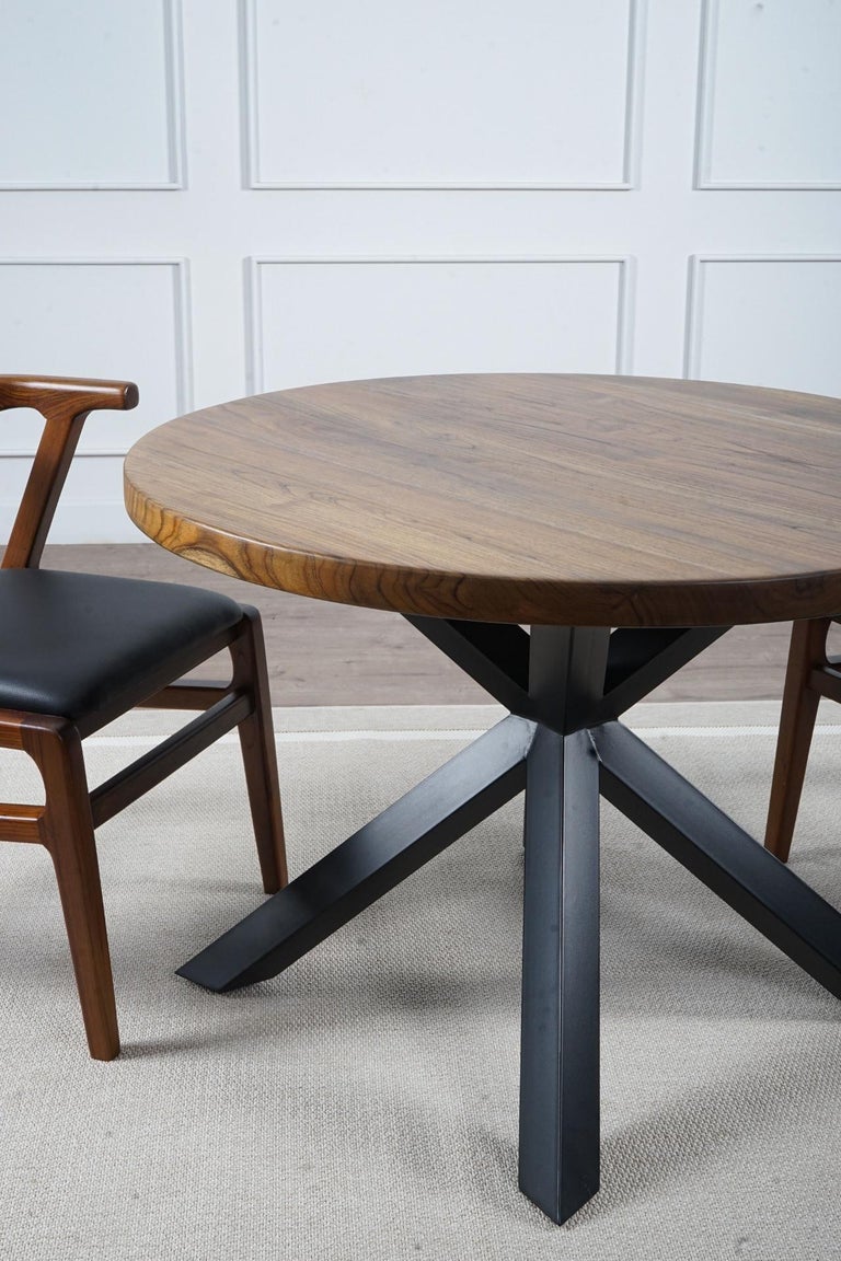 Solid Teak Round Dining Table with Black Metal Spider Legs For Sale at 1stDibs