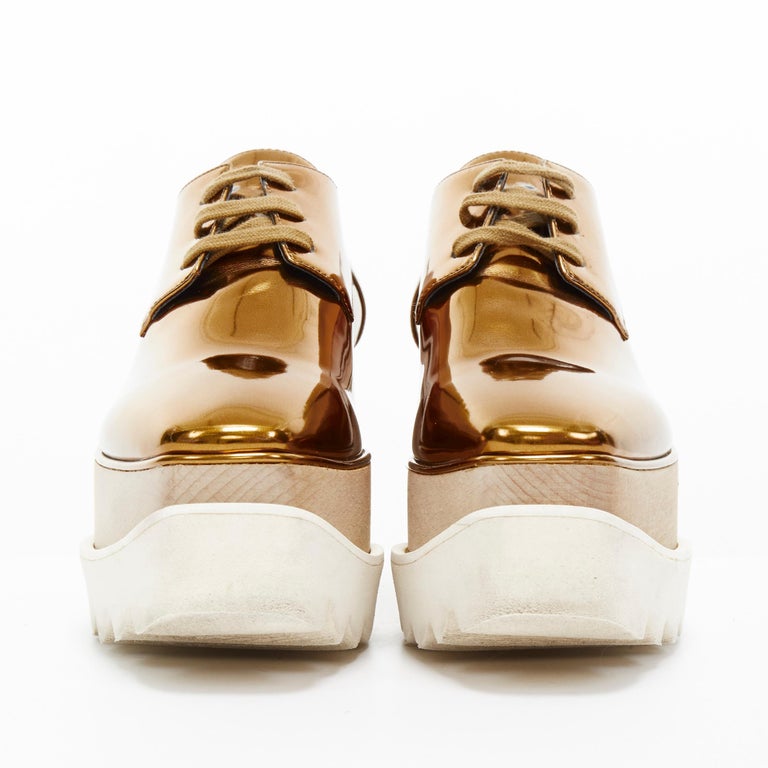 STELLA MCCARTNEY Elyse mirrored gold faux leather wooden platform ...