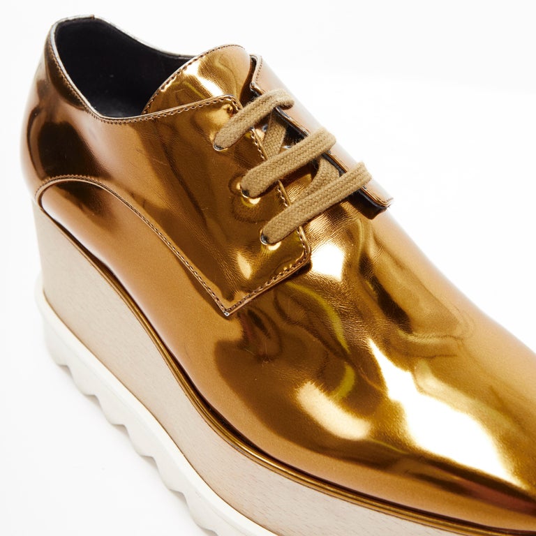 STELLA MCCARTNEY Elyse mirrored gold faux leather wooden platform ...