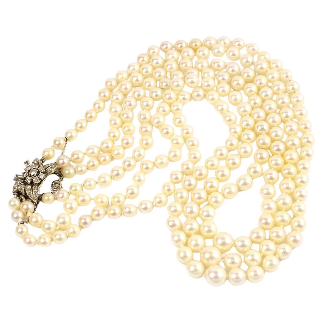 Three strands cultured pearls necklace, gold and diamond clasp, 1970's ...