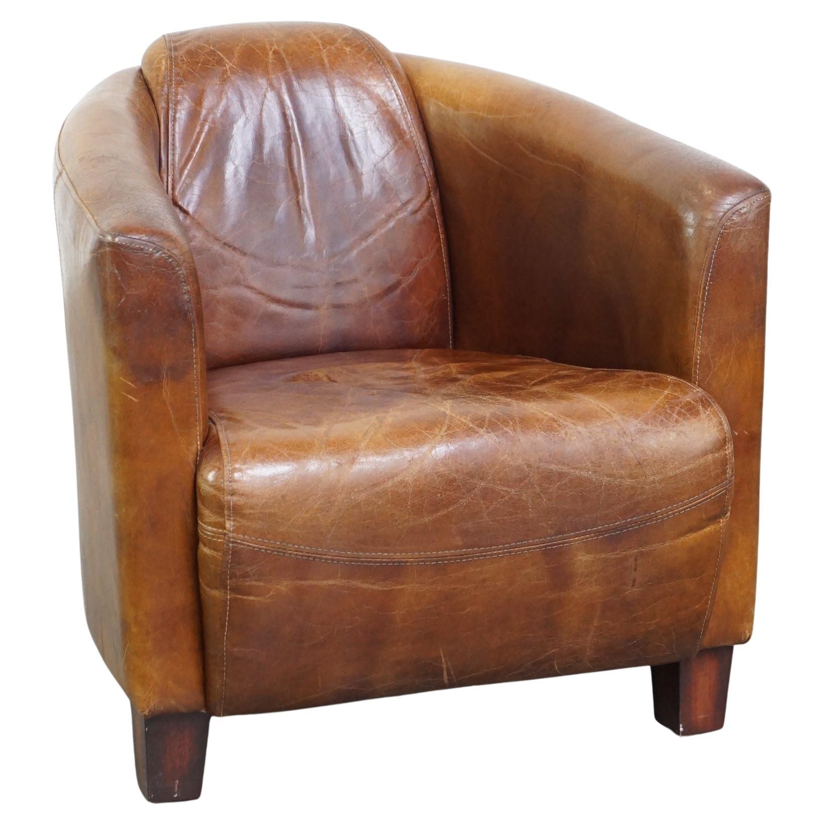 Subtle and unique cowhide leather aviator armchair with a beautiful ...