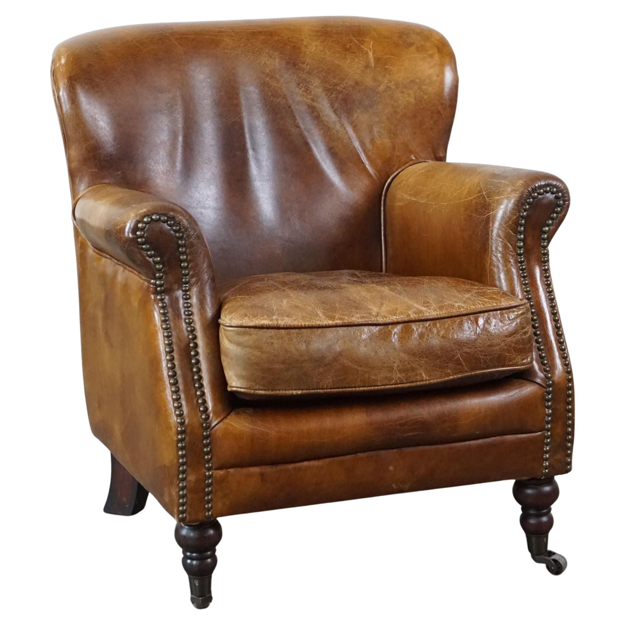 Warm cognac-colored subtle armchair For Sale at 1stDibs