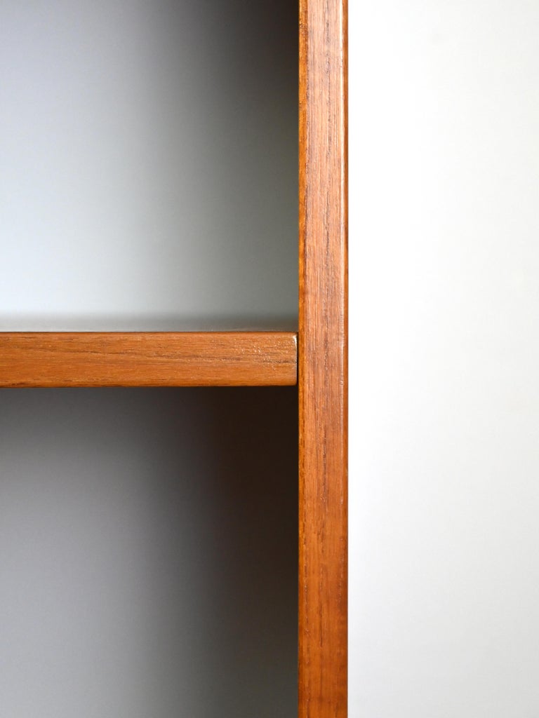 Suspended teak wood bookcase For Sale at 1stDibs