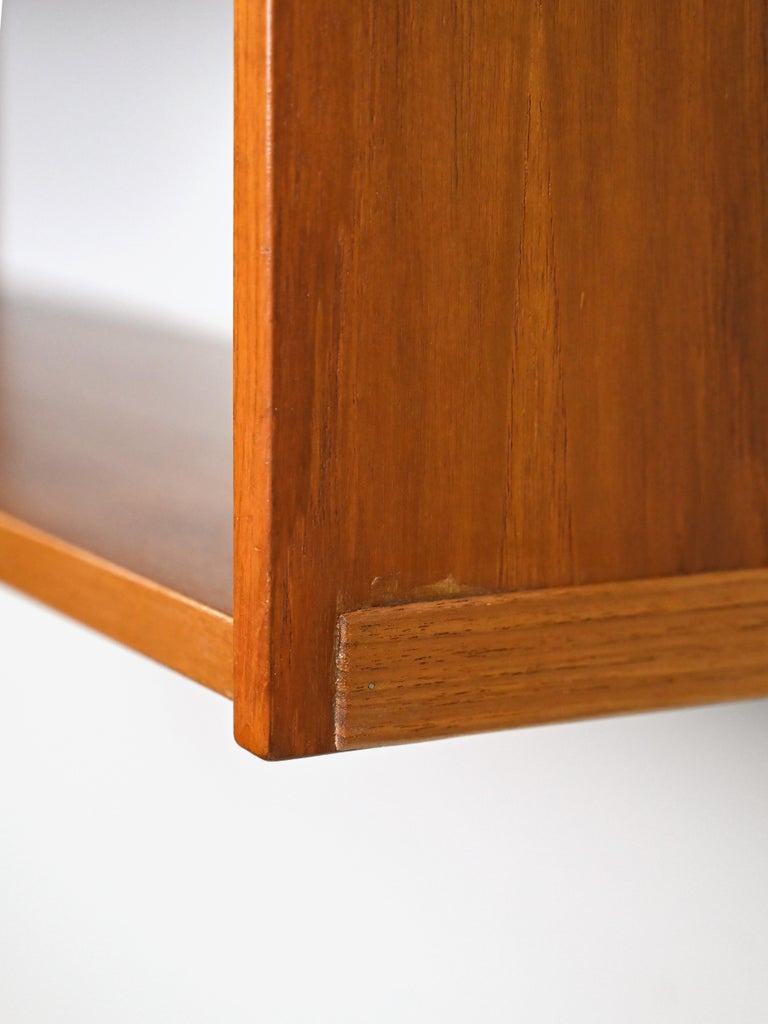 Suspended teak wood bookcase For Sale at 1stDibs