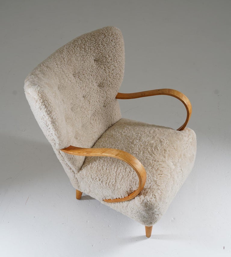 Swedish Midcentury Wingback Lounge Chair in Sheepskin For Sale at 1stDibs