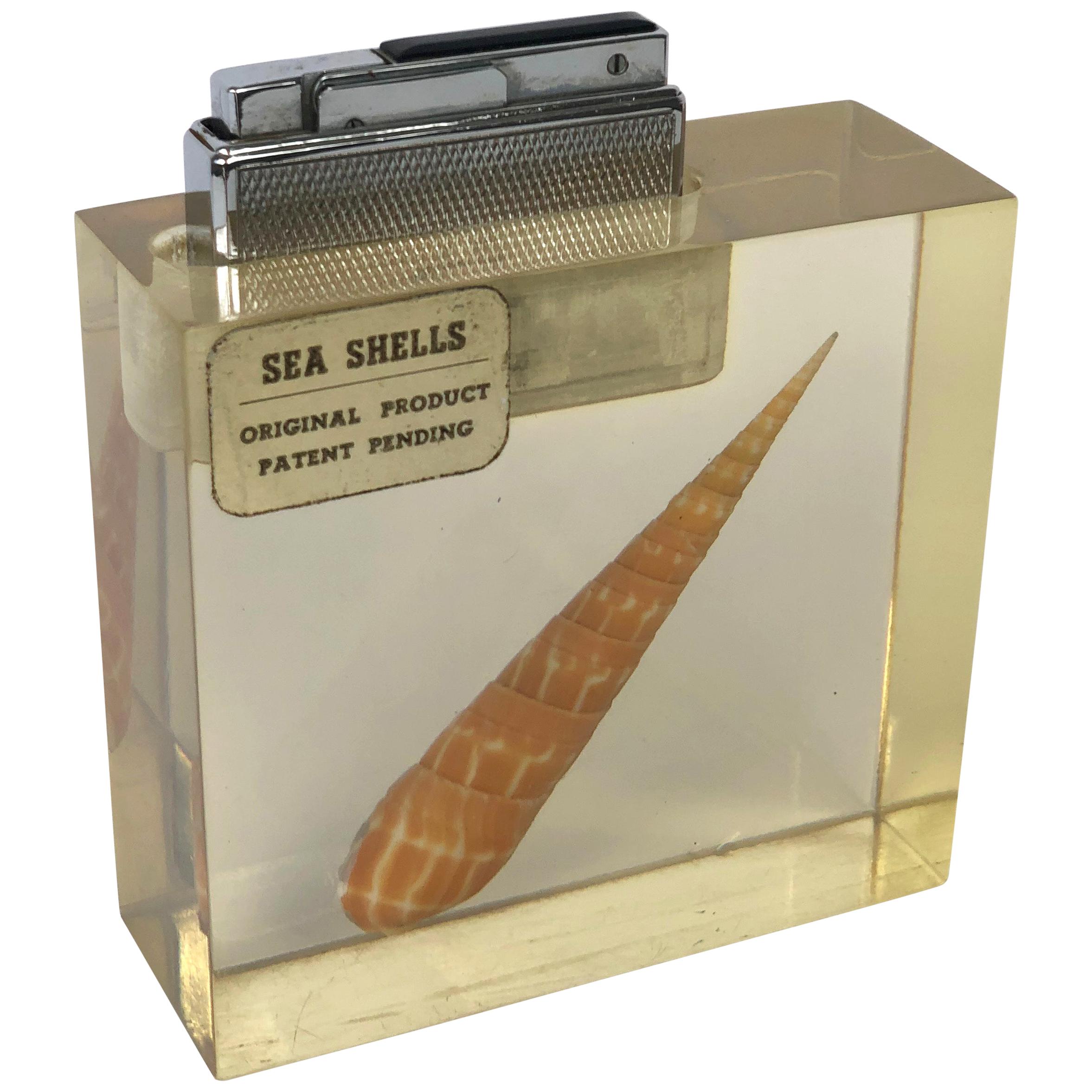 Table Lighter in Lucite Resin with a Sea Shell Inside, 1970s at 1stDibs