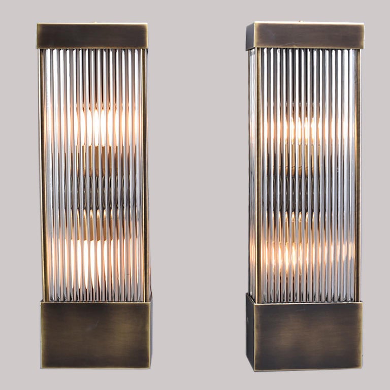 Tall Italian Mid Century Dark Brass and Ribbed Glass Sconces at 1stDibs