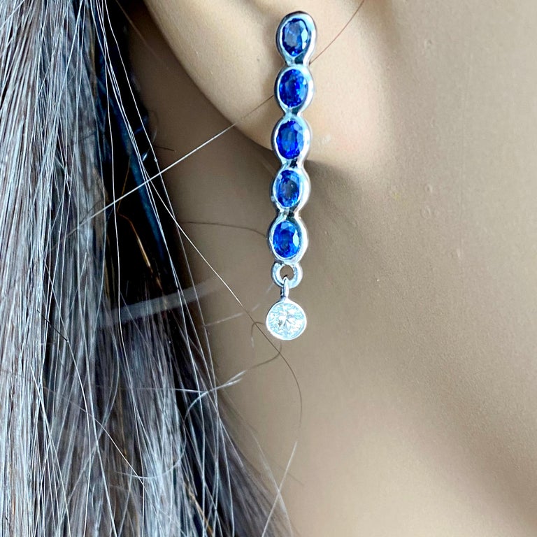Ten Oval Shaped Sapphire Drop and Two Diamonds Linear White Gold Drop ...