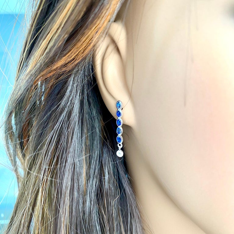 Ten Oval Shaped Sapphire Drop and Two Diamonds Linear White Gold Drop ...