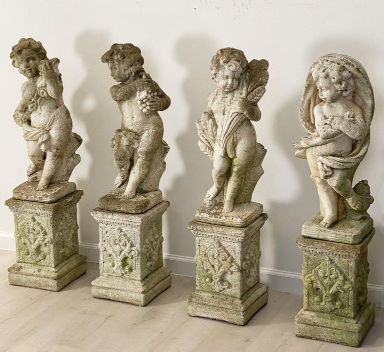 The Four Seasons Cherub Statues on Pedestals, Garden Stone Statuary at 1stDibs