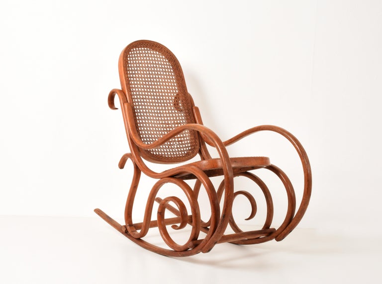 Thonet. A Vintage Bentwood Child's Rocking Chair with Cane Back and ...