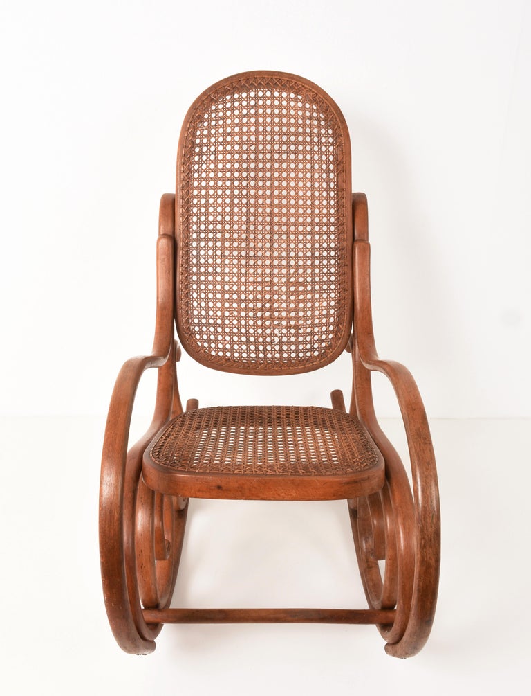Thonet. A Vintage Bentwood Child's Rocking Chair with Cane Back and ...