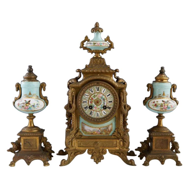 Three-Piece Gilt Porcelain Clock Set For Sale at 1stDibs