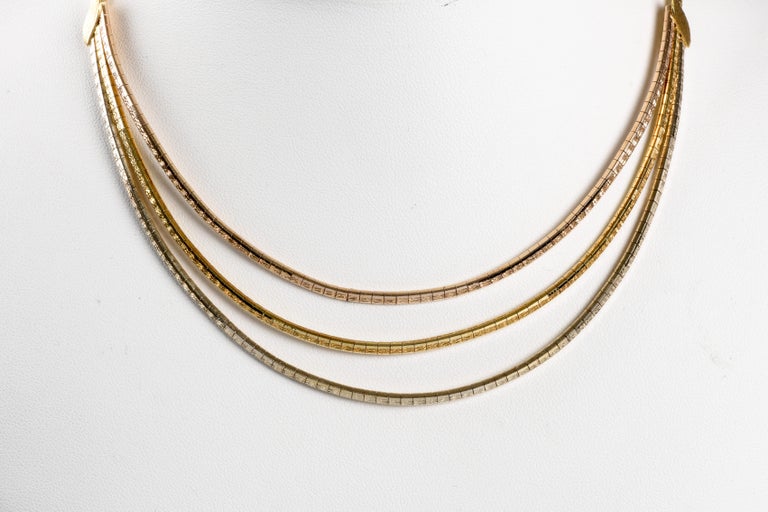 Three-row 750 gold necklace fully chiseled with yellow, white and rose ...