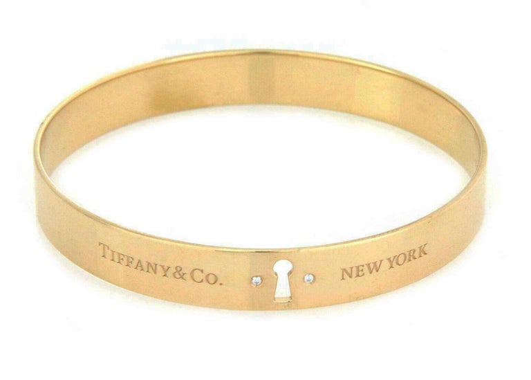 Tiffany and Co. 18k Yellow Gold Diamond Keyhole Lock Bangle For Sale at ...