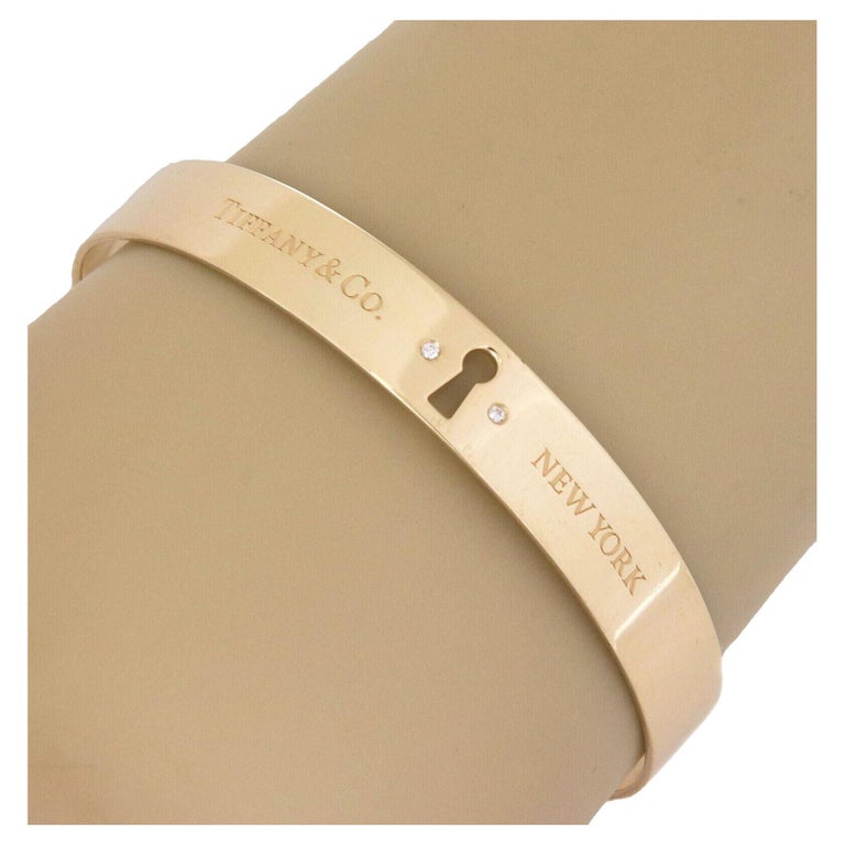 Tiffany and Co. 18k Yellow Gold Diamond Keyhole Lock Bangle For Sale at ...