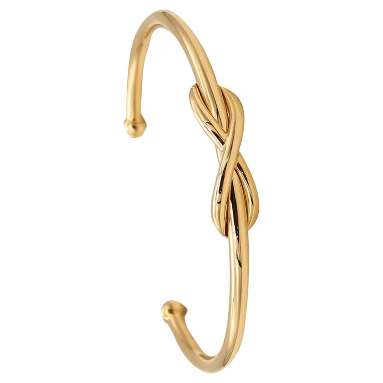 Tiffany and Co. Infinity Motif Cuff Bracelet in Solid 18Kt Yellow Gold For Sale at 1stDibs