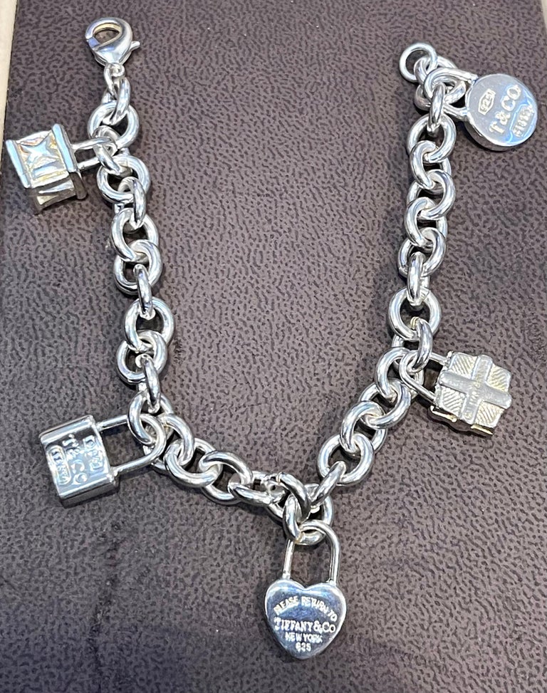 Tiffany and Co. Sterlingsilber Herz-Tageschloss and Taschen-Charm ...