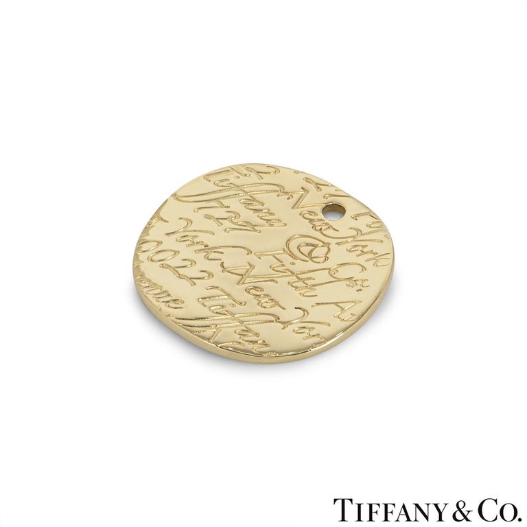 Tiffany and Co. Yellow Gold Round Notes Pendant For Sale at 1stDibs