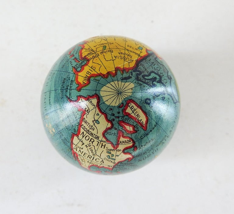 Tiny Vintage Tin Lithographed Globe Pencil Sharpener For Sale at 1stDibs