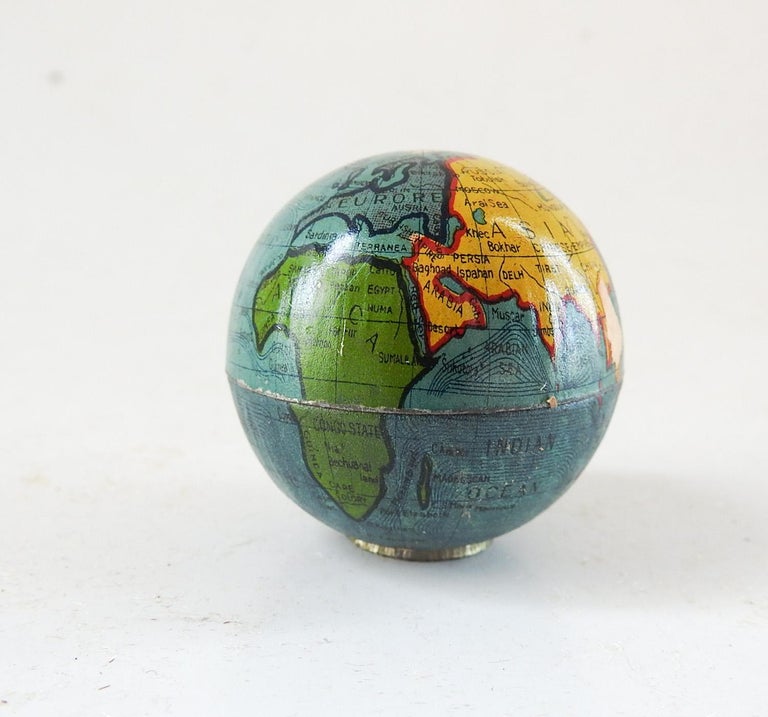 Tiny Vintage Tin Lithographed Globe Pencil Sharpener For Sale at 1stDibs