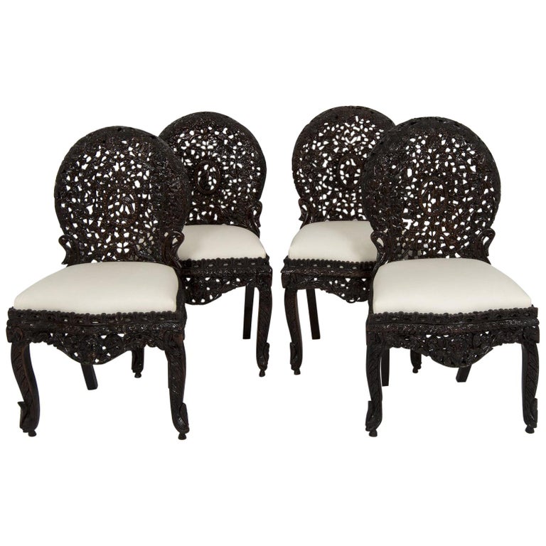 Twelve 19th Century Anglo-Indian Carved Dining Chairs at 1stDibs