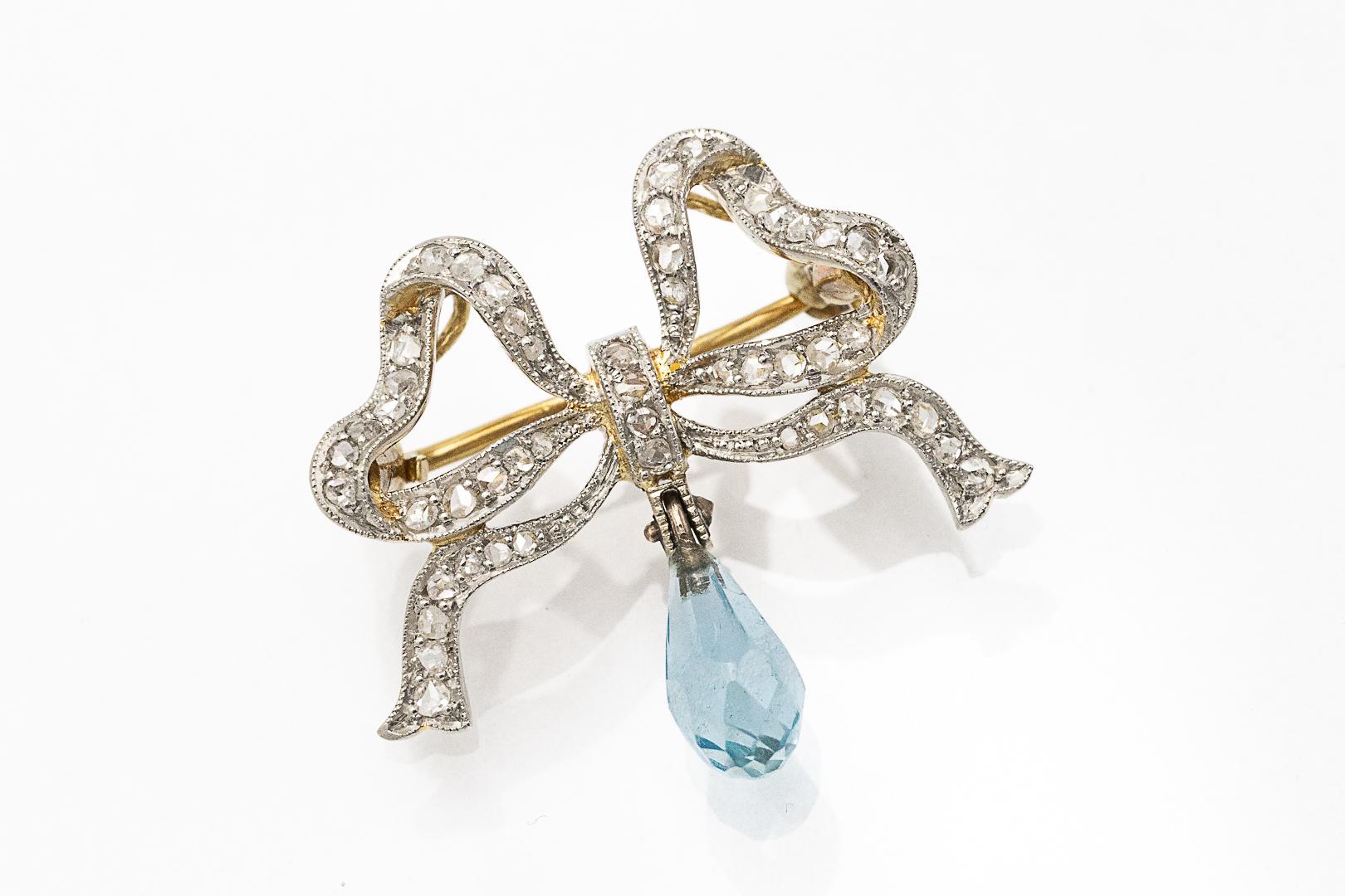 Unique brooch in the shape of a bow with diamonds and aquamarine. For ...
