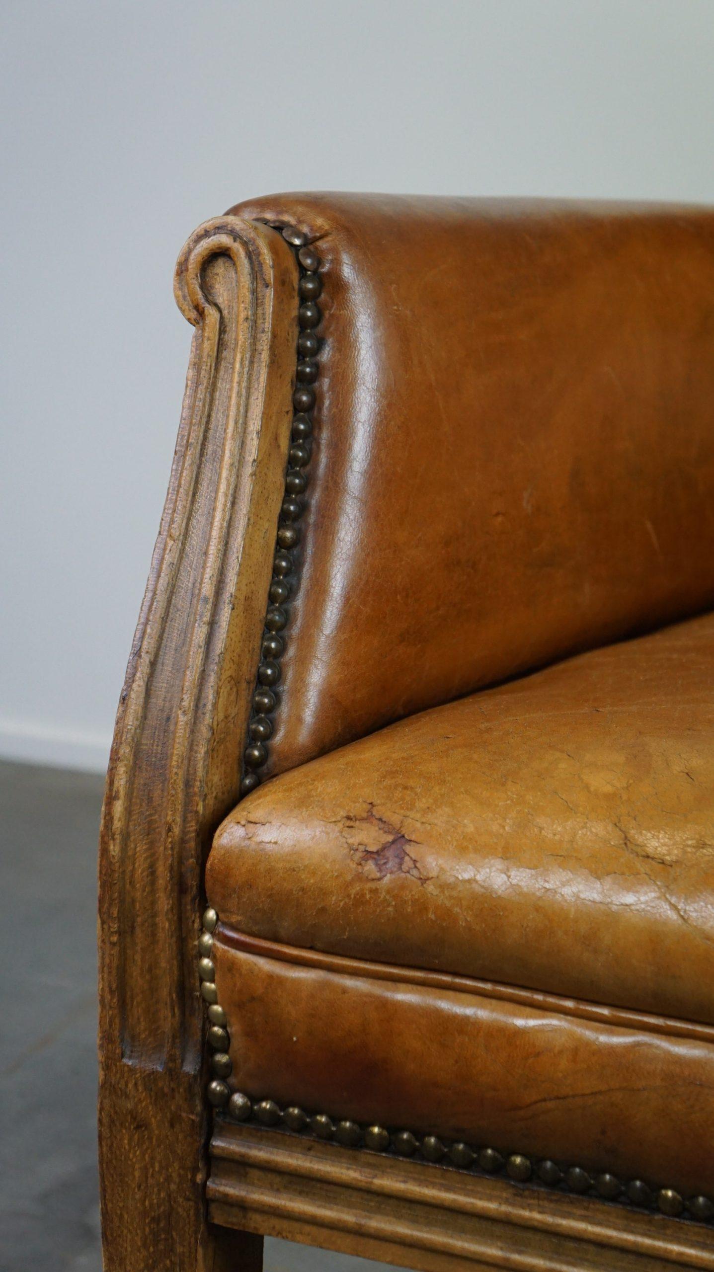 Unique leather wingback armchair with wooden details For Sale at 1stDibs