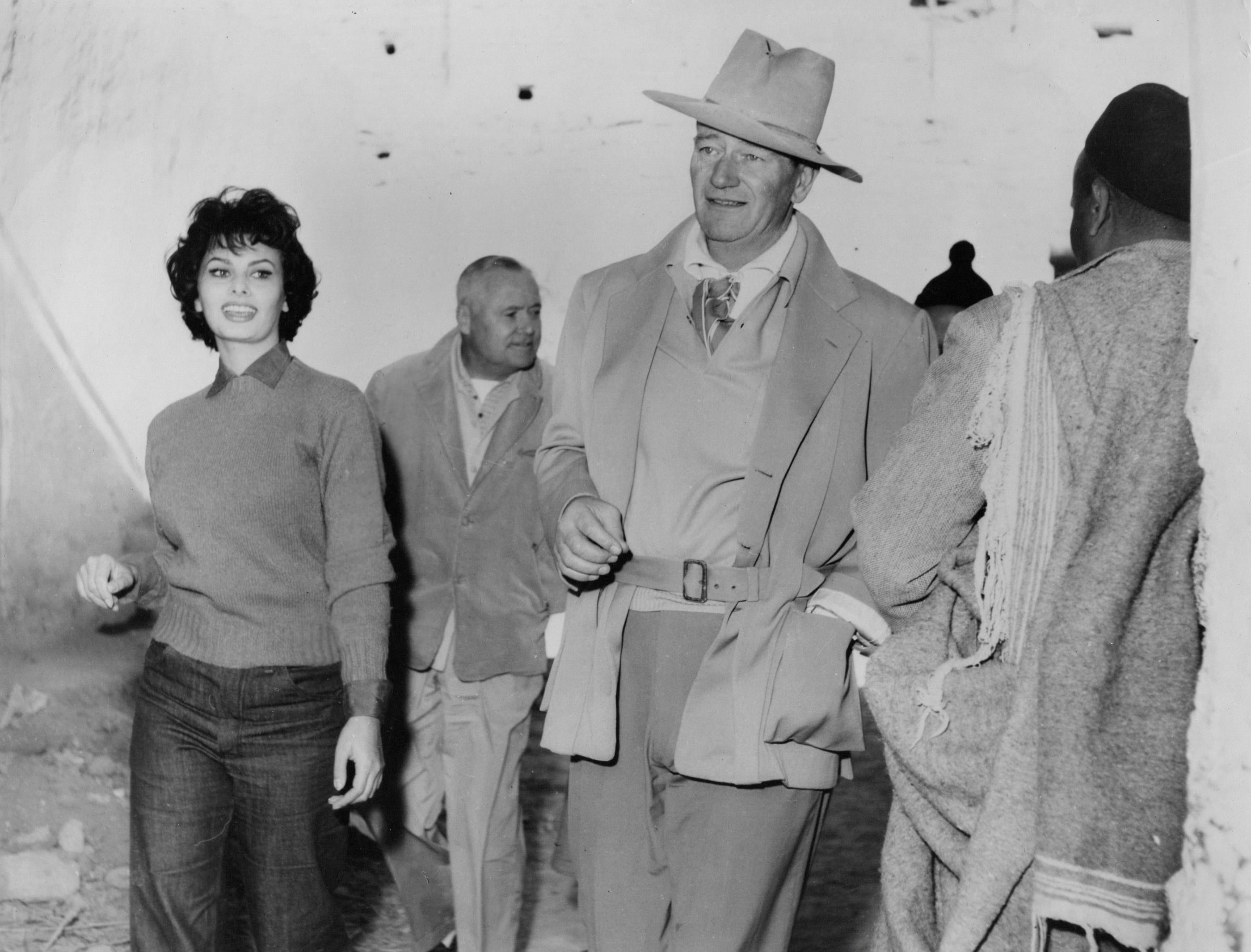 Unknown - Sophia Loren and John Wayne in "Legend of the Lost" Vintage ...