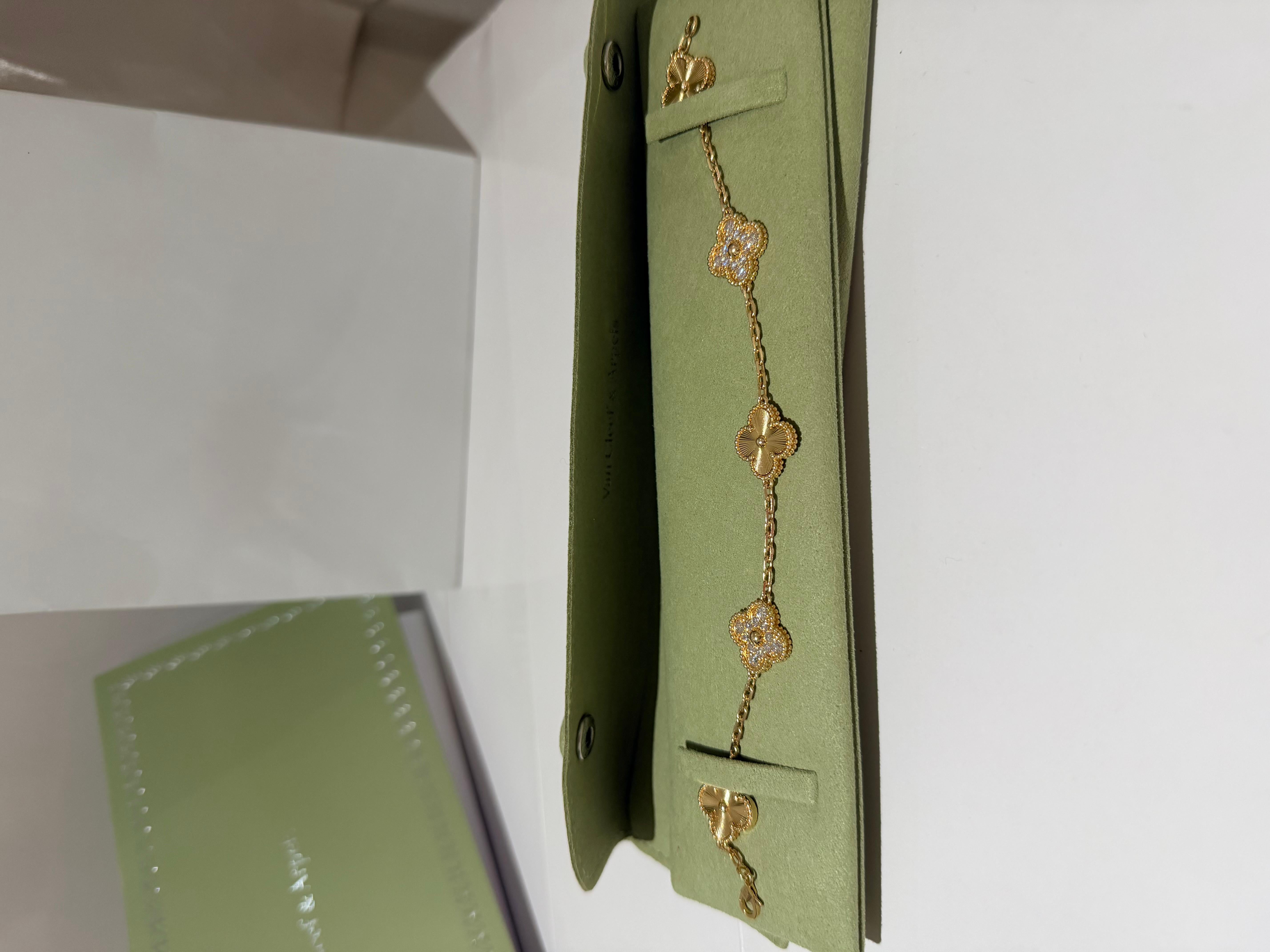 Van Cleef and Arpels 5 motif bracelet in guilloche gold and diamonds ...