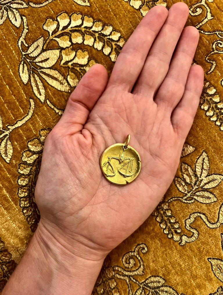 Van Cleef and Arpels 1970s Georges L'Enfant Yellow Gold Libra Zodiac Pendant For Sale at 1stDibs