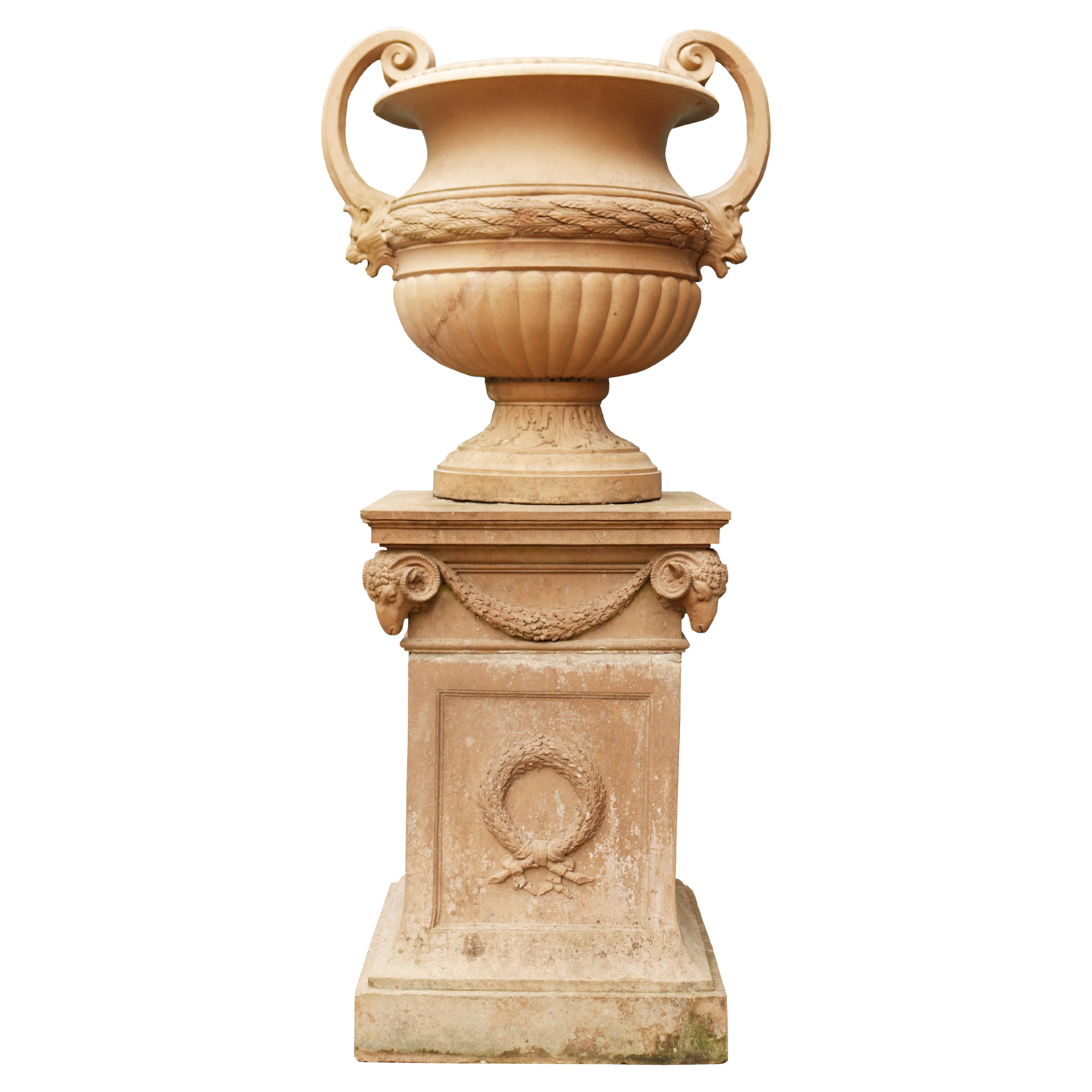A Pair of Adam Style Composition Stone Lidded Urns on Pedestals at 1stDibs