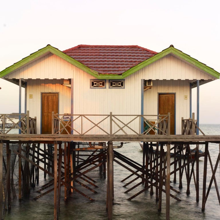 Vincent Dixon - Borneo 1: stilt house architecture in water landscape at sunrise, Southeast Asia ...