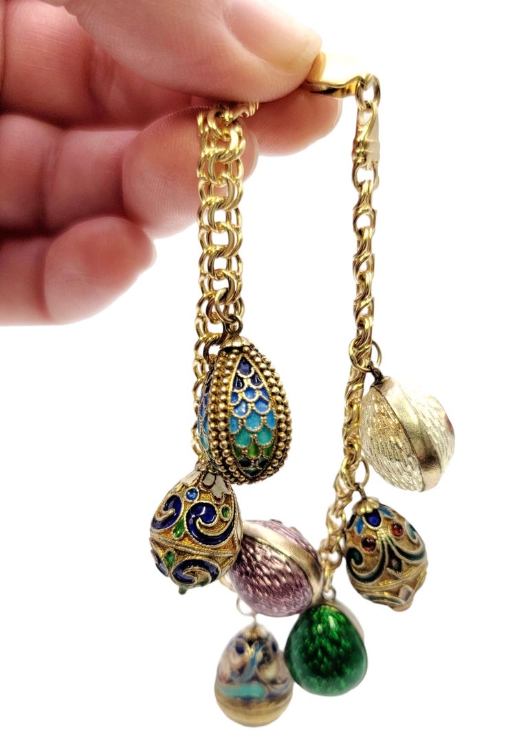 Vintage 14 Karat Yellow Gold Charm Bracelet with 7 Colorful Enamel Egg Charms For Sale at 1stDibs