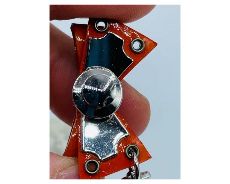 Vintage Christian Dior Orange Dior Bowtie Pin For Sale at 1stDibs