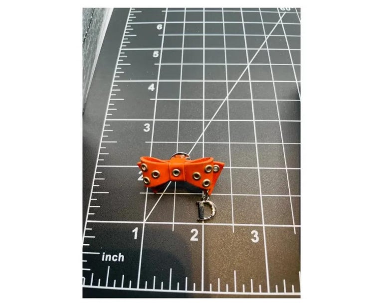 Vintage Christian Dior Orange Dior Bowtie Pin For Sale at 1stDibs