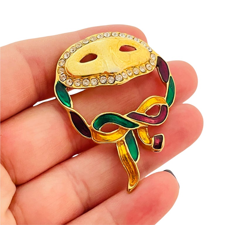 Vintage gold enamel rhinestone mask designer runway brooch at 1stDibs