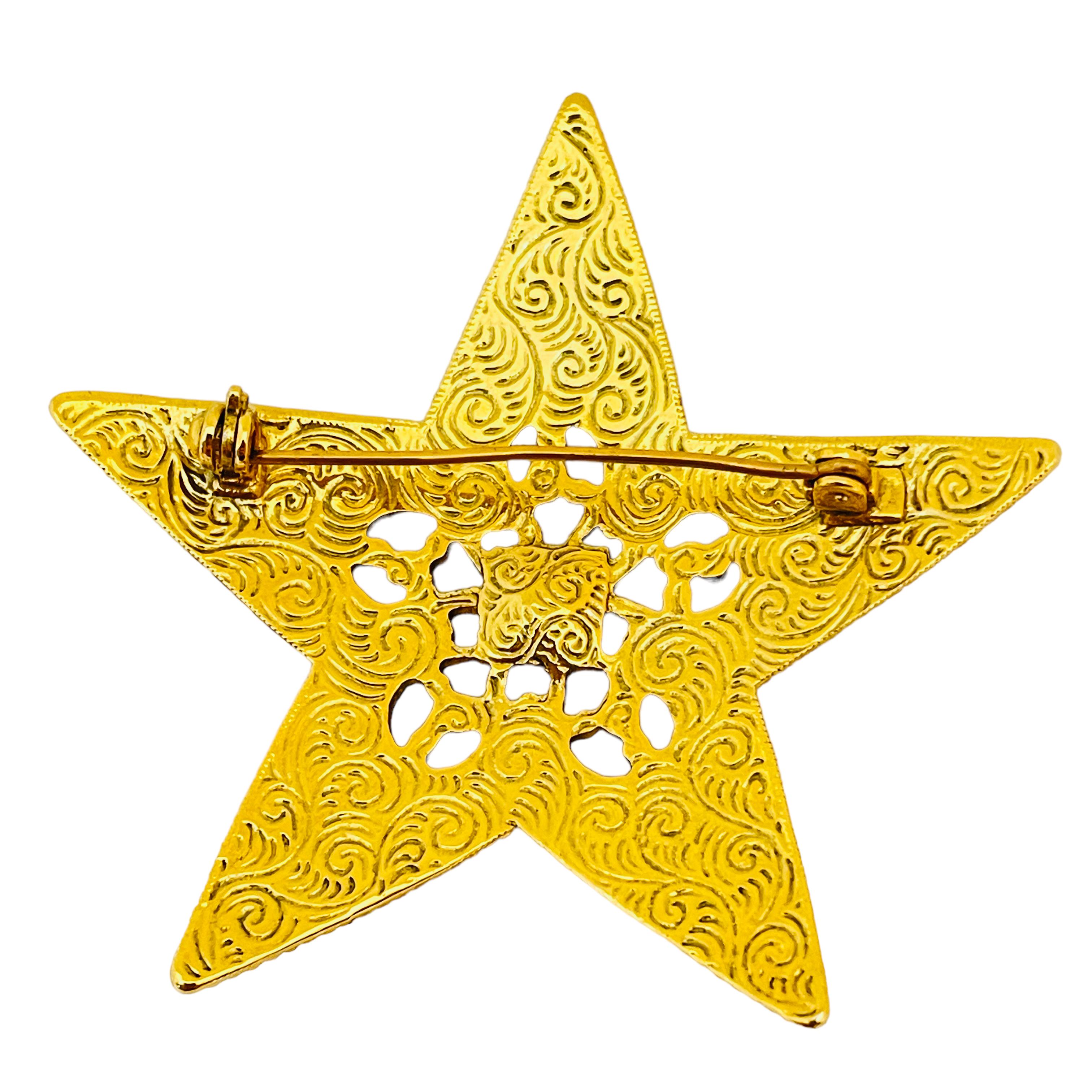 Vintage gold rhinestone star designer runway brooch For Sale at 1stDibs