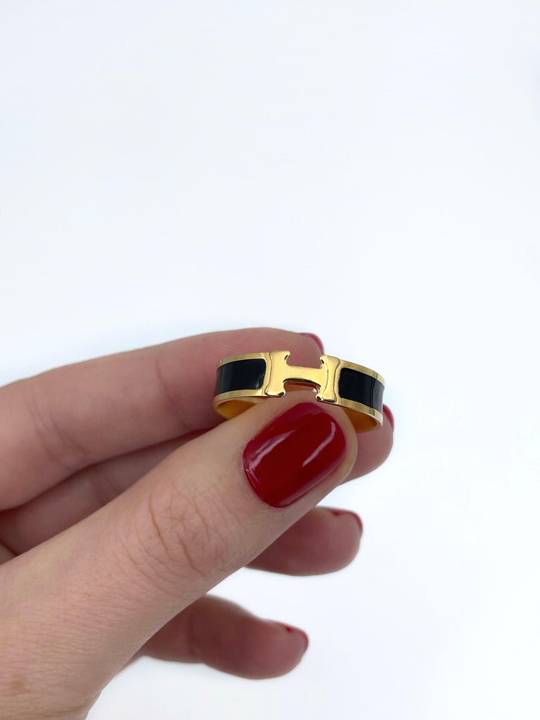 Vintage Hermès 18 Karat Yellow Gold Black Enamel Clic H Ring at 1stDibs