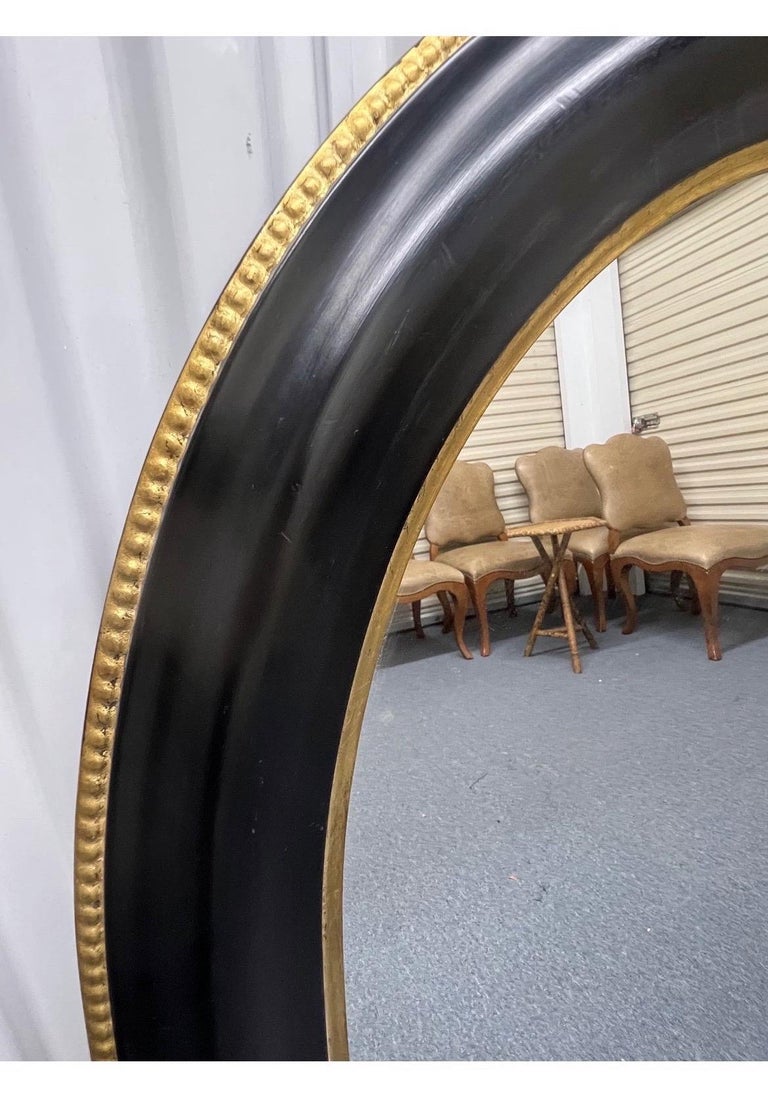 Vintage Italian Giltwood and Ebonized Oval Mirror For Sale at 1stDibs