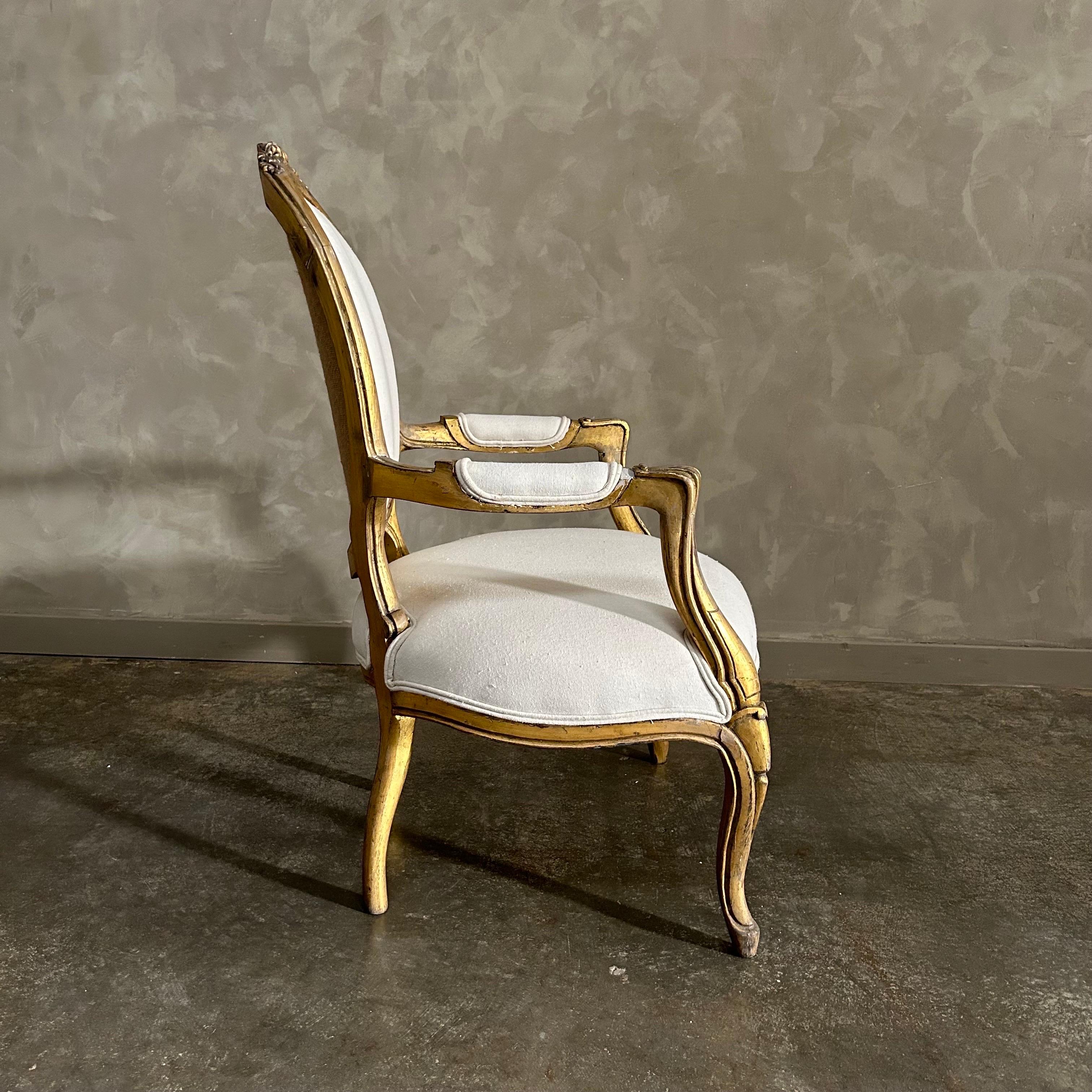 Vintage Louis XV style open arm giltwood chair For Sale at 1stDibs