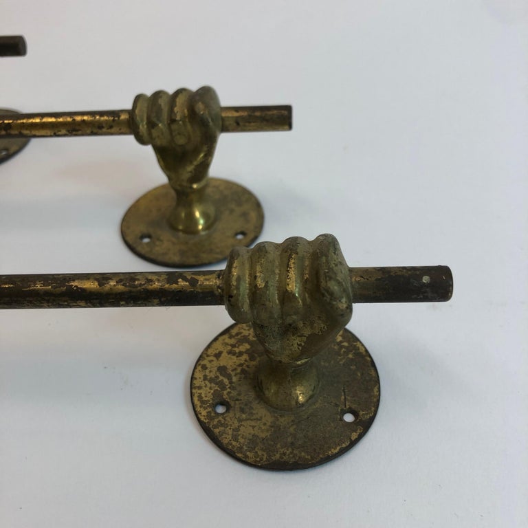 Vintage Metal/Brass Hands/Fists Holding a Towel Rail at 1stDibs