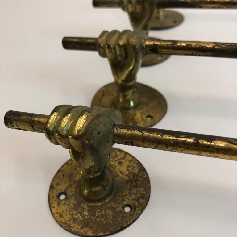 Vintage Metal/Brass Hands/Fists Holding a Towel Rail at 1stDibs